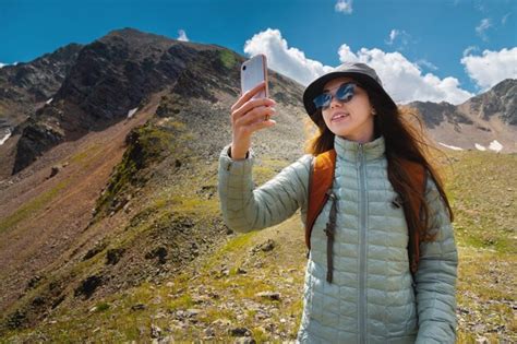 Premium Photo Beautiful Happy Hiker Woman Taking A Selfie Hiking A