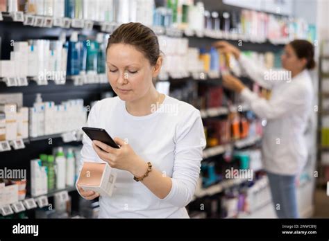 In Pharmacy Visitor Scan Qr Code And Reads Composition Of Cream For