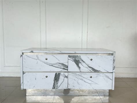 ตู้เก็บของ 4 ชิ้นชัก โครงไม้อัดปิดผิวไฮกรอสลายหินอ่อน Kaidee