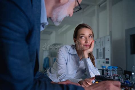 Two Robotics Engineers Working On New Project Standing In Laboratory Concept Of Modern