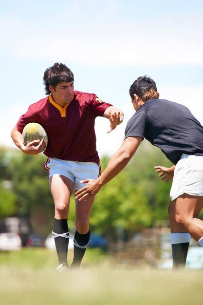 Premium Photo Rugby Player Game And Tackle On A Field During