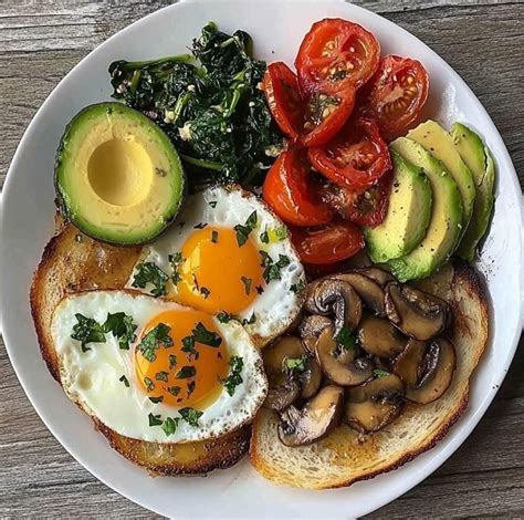 Healthy Breakfast Plate With Eggs Sautéed Veggies And Avocado Toast 🥑🍳🍅