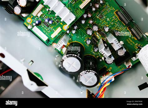 View Of Large Capacitors Housed In A Class D Amplifier Surrounded By An Intricate Layout Of