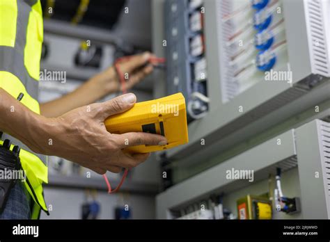 Electrician Engineer Work Tester Measuring Voltage And Current Of Power