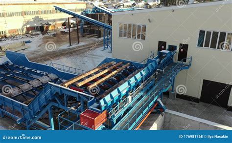 aerial view of automated log sorting line production of timber from wood woodworking