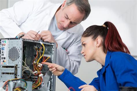 Teacher With Female Babe In Technology Repairing Computer Stock Photo Image Of Class