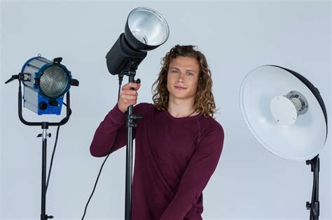 Premium Photo Photographer Fixing Spotlight