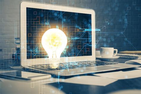 Premium Photo Computer On Desktop In Office With Bulb Icon Hologram