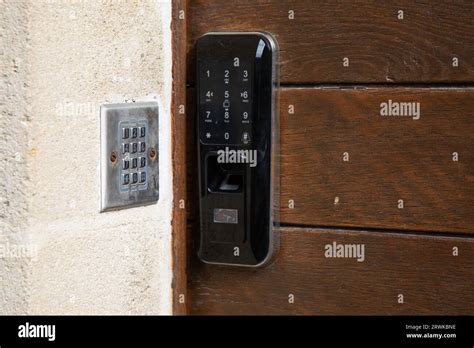 Ring Surveillance Video And Numeric Keypad Password On Old Wooden Door