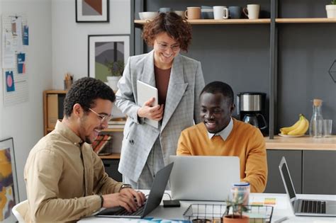Premium Photo Group Of Programmers Working Over New Software