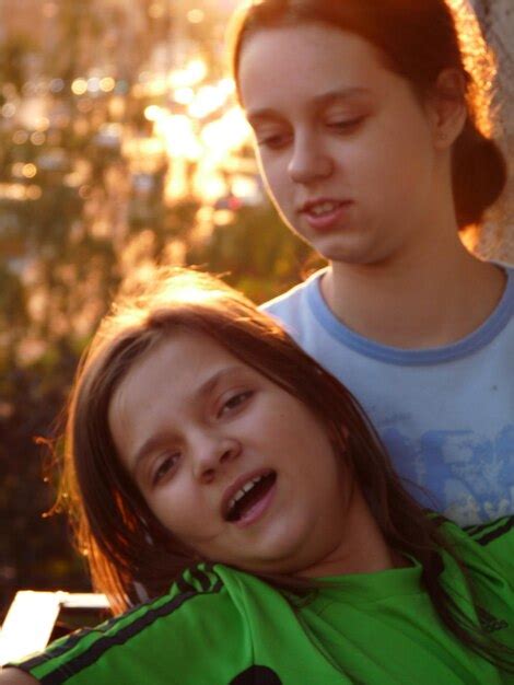 Premium Photo Close Up Of Siblings