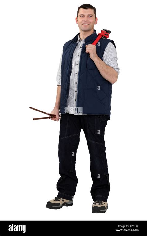 Plumber Holding Wrench And Pipe Stock Photo Alamy