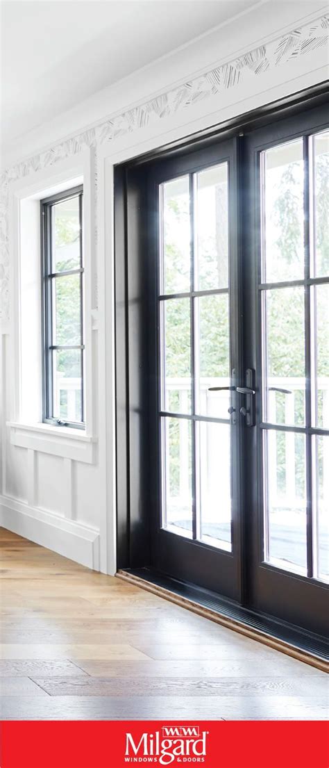 Black French Patio Doors Add A Dark Elegance To This Farmhouse Dining
