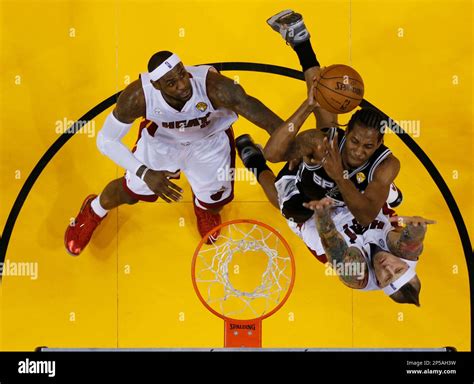 San Antonio Spurs Forward Kawhi Leonard 2 Drives To The Basket As Miami Heat Forwards Chris