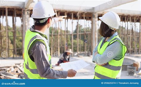 Female And Male Civil Engineers Discuss Details Of Construction Site Inspection Project