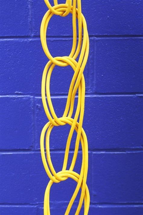 How To Wrap An Extension Cord Like A Boss Cord Storage Extension Cord Power Cord Storage