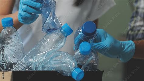 Garbage Separation Concept Female Hands Separate Paper And Plastic Into Separate Containers In