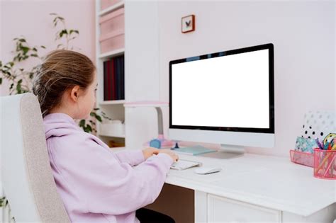 Premium Photo A View From Behind The Back Of A Teenage Babe Girl Who Uses A Desktop Computer