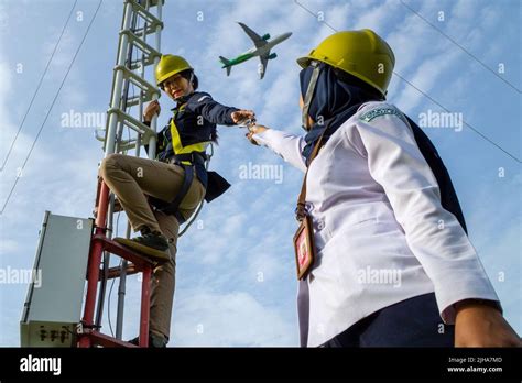 Badung Bali Dec 8th 2020 In A Clearly Day 2 Female Technical Workers Repairing Communication
