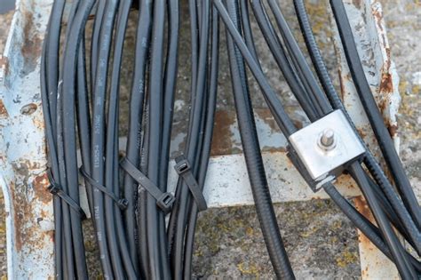 Premium Photo A Lot Of Thick Black Wires Come Out Of The Cell Tower