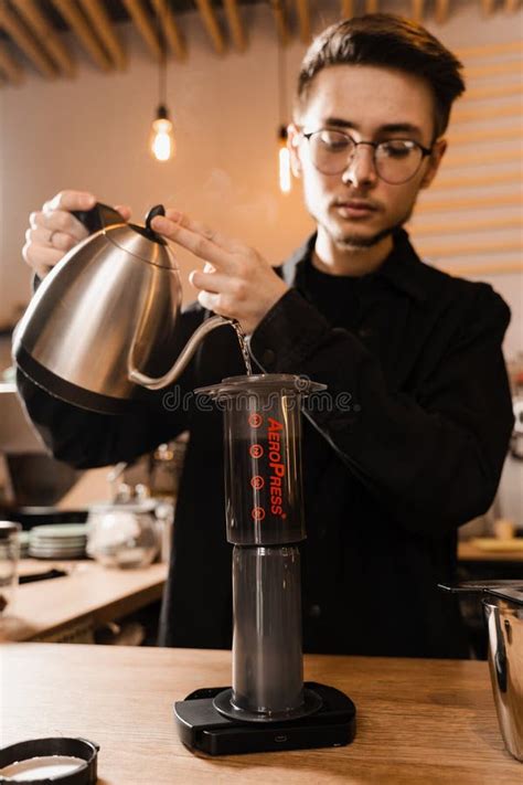 Barista Is Brewing Aeropress Coffee In Cafe Process Of Aeropress