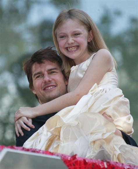 Tom Cruise Shares A Kiss With Elle Fanning As They Reunite At The Saturn Awards