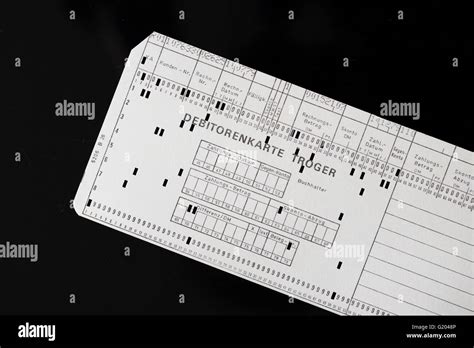A Computer Punch Card Used For An Early Computerized Accounting System Running On A Historic