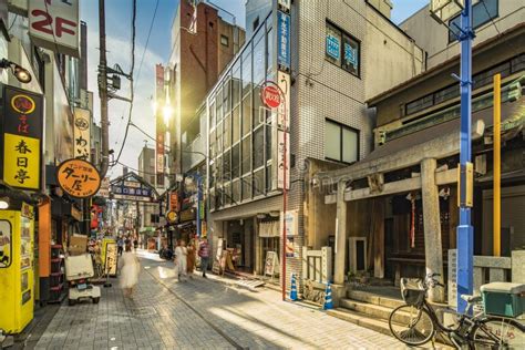 Tiny Shinto Satake Inari Jinja Shrine With A Stone Gate Torii In The Shopping Street Located At
