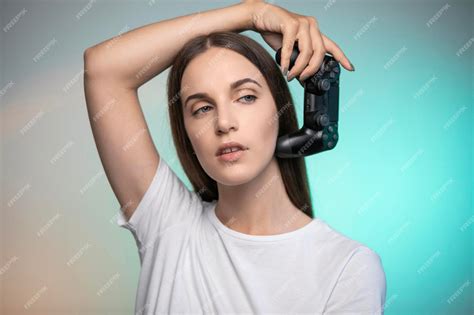 Premium Photo Beautiful Woman Holding Console Controller On Colorful Premium Photo Beautiful Woman Holding Console Controller On Colorful