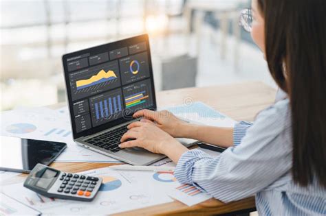 Professional Data Analyst Using Data Visualizations Dashboard On Computer Monitor For Data