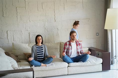 Premium Photo Exhausted Mother And Father Sitting On Couch Feels