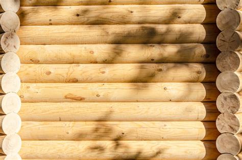 Premium Photo Texture Of Wall Of House Made Of Rounded Logs Wooden Log Wall Built From