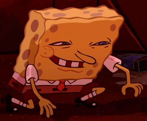Spongebob Is Sitting On The Ground And Smiling