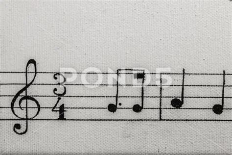 Photograph Black Sheet Music A Clef And Music Lines On White Background 145898572