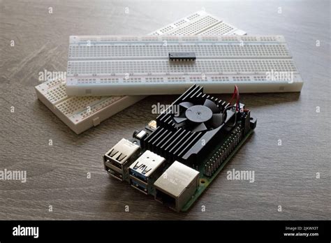 raspberry pi microcomputer with large black heatsink and breadboard for