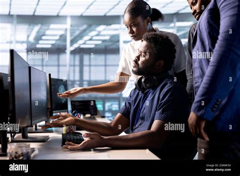 Team Of Data Center Programmers Using Programming Languages To Construct Algorithms And Build