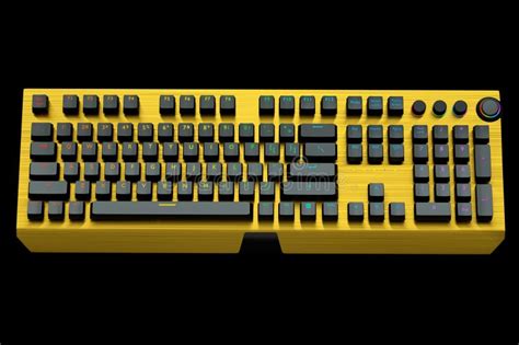 yellow computer keyboard with rgb colors isolated on black background