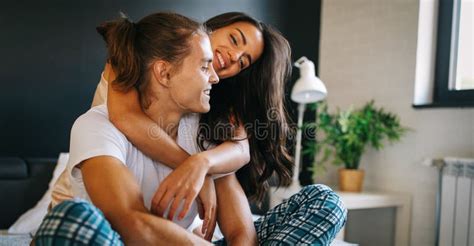 Sensual Foreplay By Happy Couple In Bedroom Stock Image Image Of