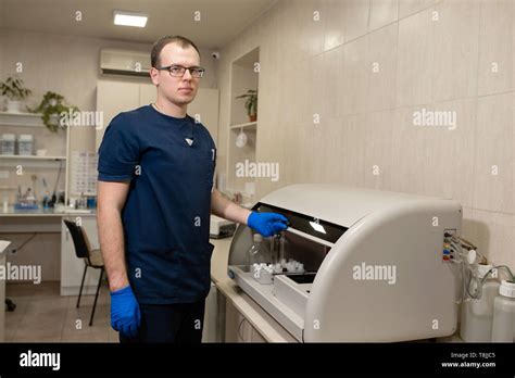 Laboratory Assistant Make Test Blood In Automatical Blood Sample