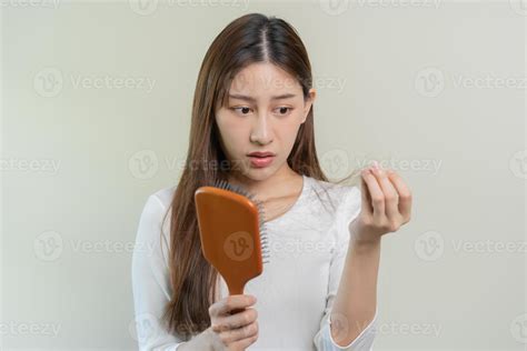 Serious Worried Asian Young Woman Girl Holding Brush Show Her Comb Hairbrush With Long Loss
