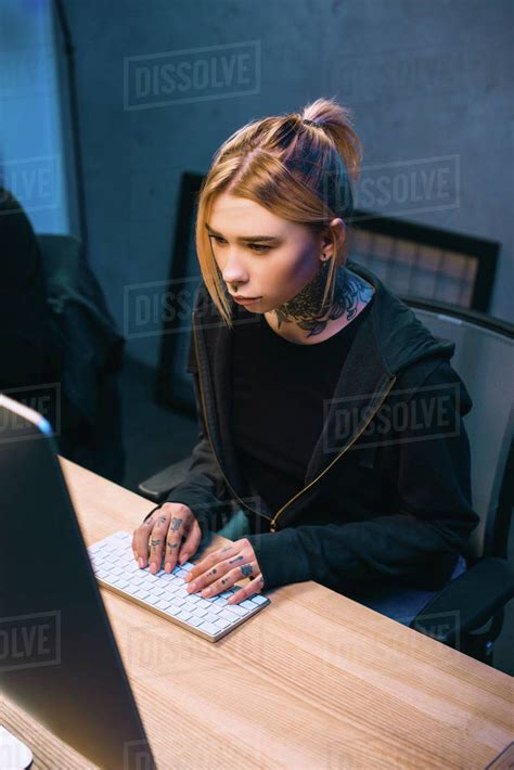 High Angle View Of Serious Babe Female Hacker Developing Malware Royalty Free Stock Photo