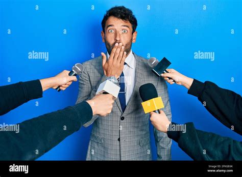 Handsome Man Business With Beard Being Interviewed By Reporters Holding