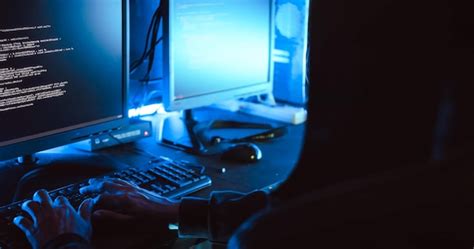 Premium Photo A Male Hacker Is Using A Computer To Hack Data To