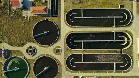 Aerial Top Down View Of Water Basins At Sewage Treatment Plant Ponds