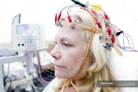 Mature Blonde Woman Undergoing Electroencephalography Monitoring — Medical Test Neurology