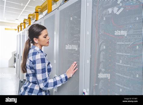 Female Technician Working On Server Maintenance In White Server Room Stock Photo Alamy