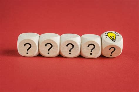 flipping of glowing lightbulb and question mark on wooden cube for