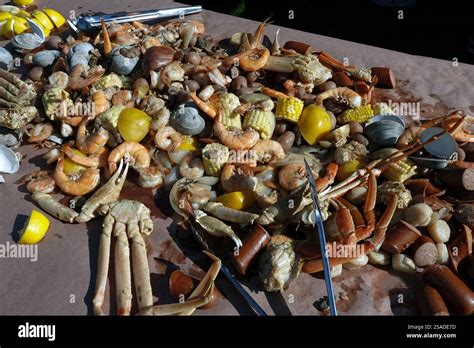A Seafood Boil Of Shellfish Including Crab And Shrimp Mixed With
