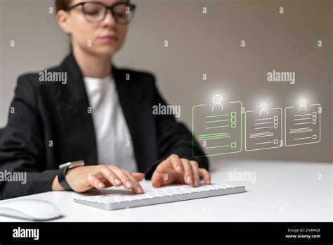 Human Resource Manger Working On Computer With Virtual Infographic Digital Employee Application