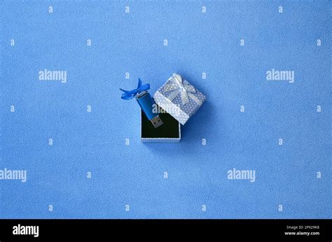 Brilliant Blue Usb Flash Memory Card With A Blue Bow Lies In A Small Gift Box In Blue With A